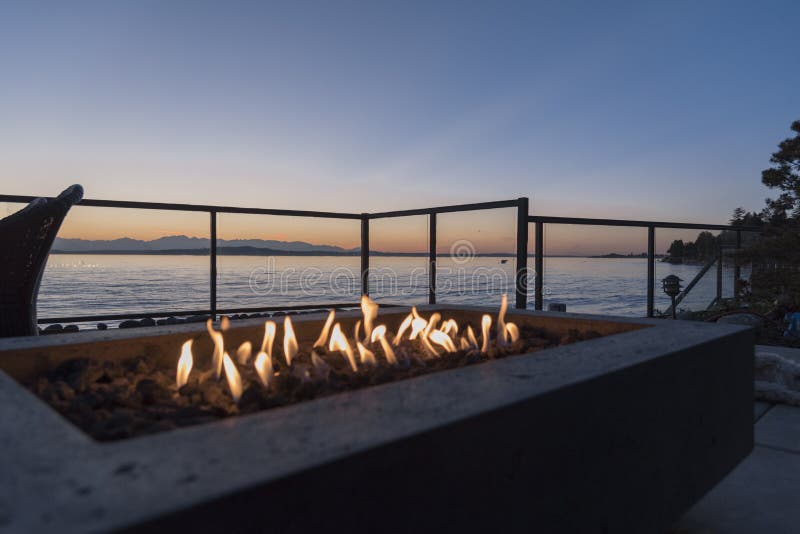 Fire Pit by the Sea at Sunset Stock Image - Image of ocean, luxury ...