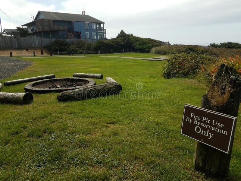 Fire Pit Use by Reservation only Sign with Water in Newport, Oregon ...