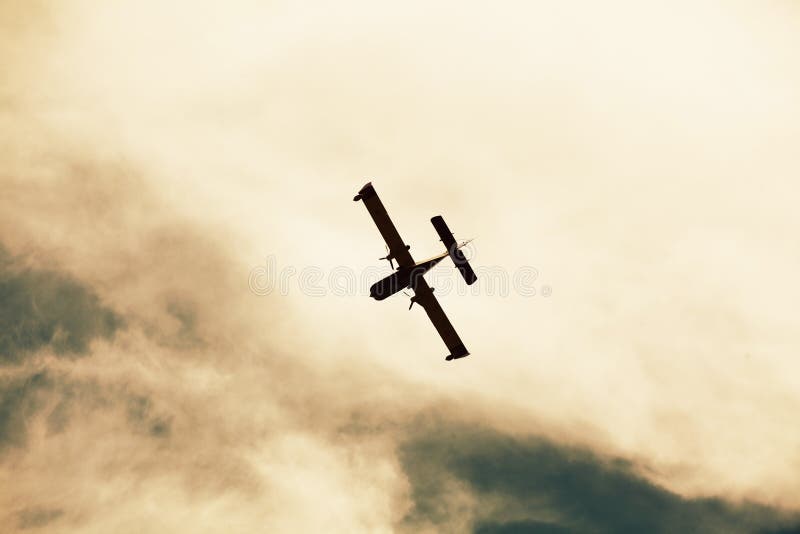 Fire Plane Flying in Clouds Background. Stock Image - Image of motion ...