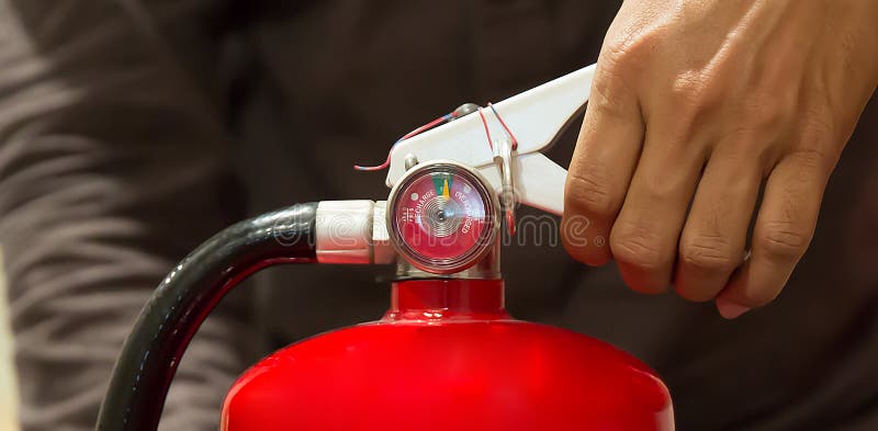 Fire Protection Engineer Check the Handle of Red Fire Extinguishers ...