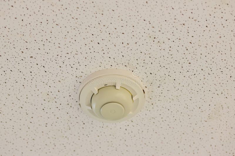 Fire Protection. Smoke Detector in the Room on White Ceiling in the ...