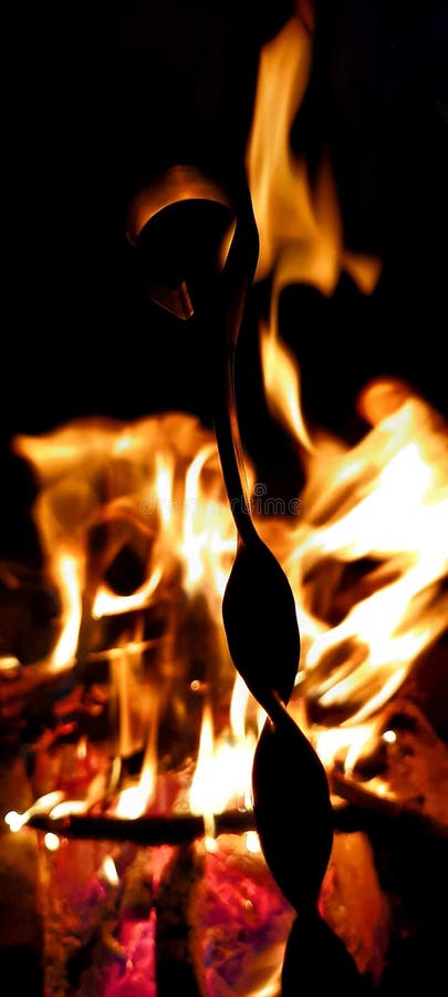 Fire. Question Mark on Fire. Fire Plays on the Metal. Tongue of Flame ...