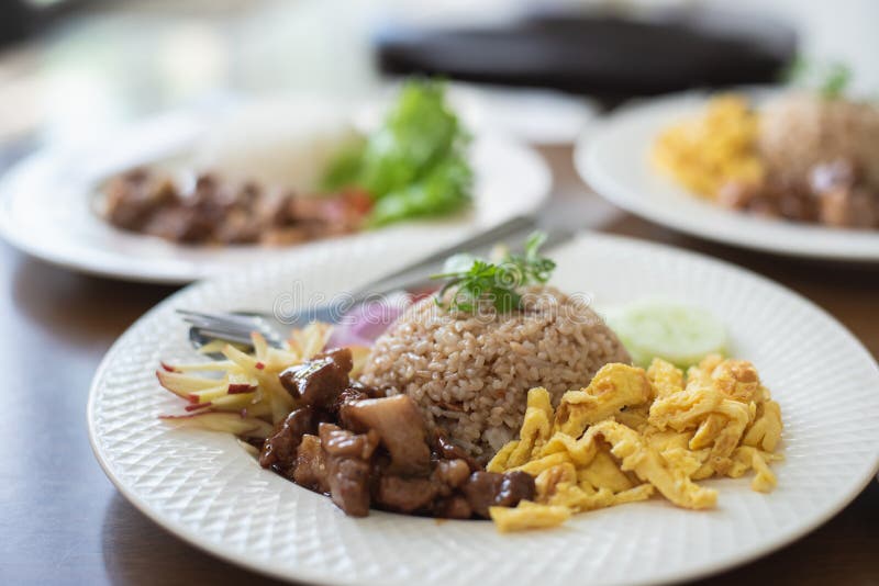Fire Rice with Pork and Fire Egg on Wood Table Stock Image - Image of ...