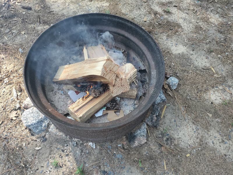 Fire ring just started stock image. Image of asphalt - 225703577