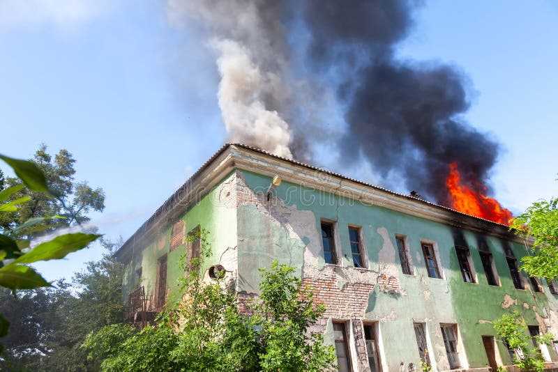 A Fire on the Roof of an Old Abandoned Building Stock Image - Image of ...