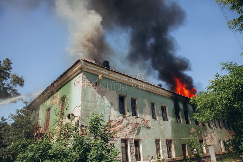 A Fire on the Roof of an Old Abandoned Building Stock Image - Image of ...