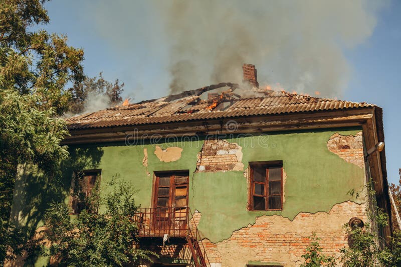 A Fire on the Roof of an Old Abandoned Building Stock Photo - Image of ...