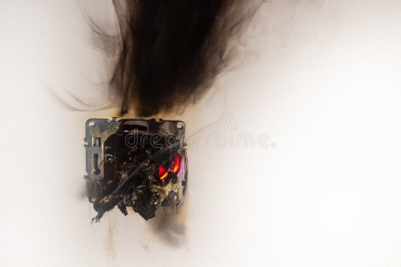 Burnt and Sooty Electrical Socket on a White Wall Stock Image - Image ...