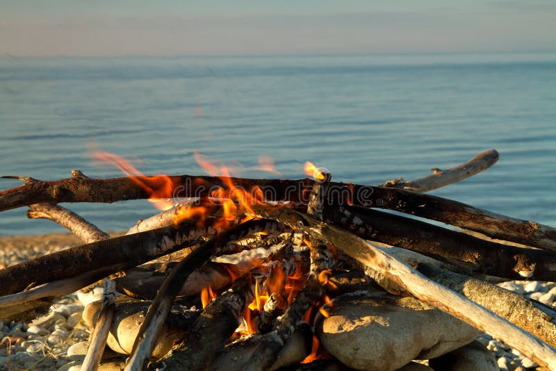 Fire at sea stock photo. Image of nature, camp, dusk - 46007542