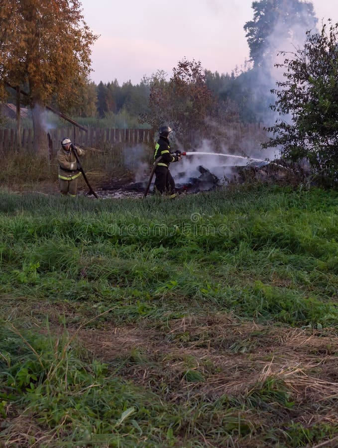 Fire Service Employees Extinguish the Fire. Firefighters at the Scene ...
