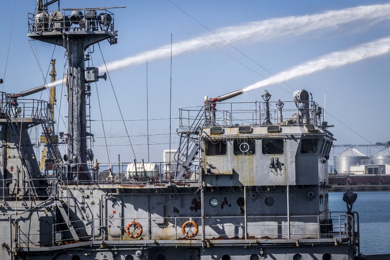 A Fire Ship Extinguishes a Fire on Another Vessel. Stock Photo - Image ...