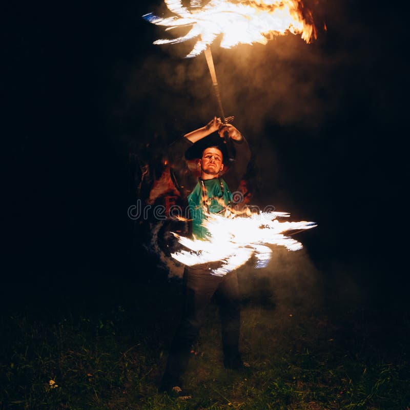 Fire Show at Night. Young Man Stands in Front of Editorial Image ...