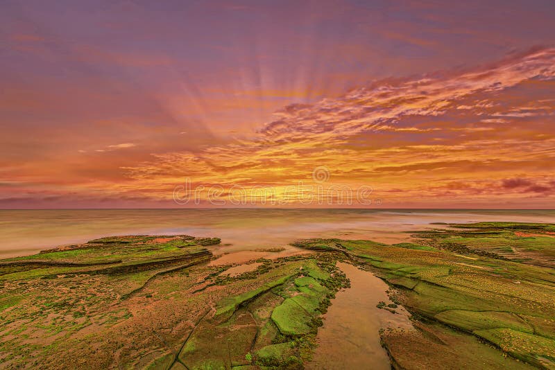 Fire in the Sky with Patches of Green Algae Stock Photo - Image of ...