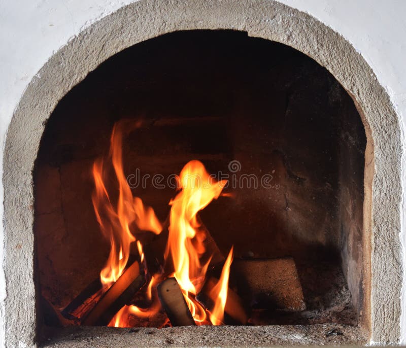 Fire in a small fireplace stock photo. Image of small - 221255372
