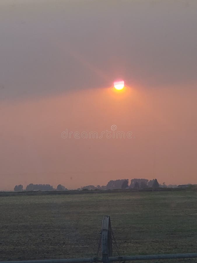 Fire smoke red sky and sun stock image. Image of sunlight - 196794641