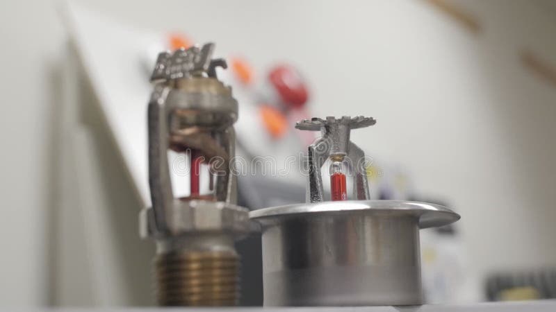 Fire Sprinkler Heads with Fusible Links and Frangible Bulbs Stock ... Fire Sprinkler Heads with Fusible Links and Frangible Bulbs Stock ...
