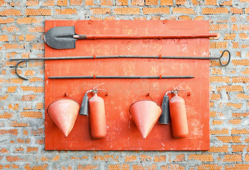 Fire Stand with Tools on a Brick Wall. Stock Image - Image of board ...