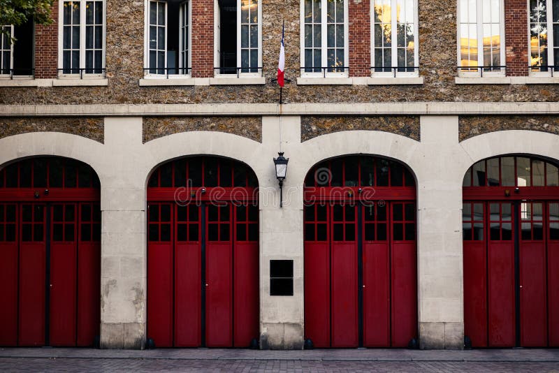 Fire Station Building Exterior with Red Gates Stock Photo - Image of ...