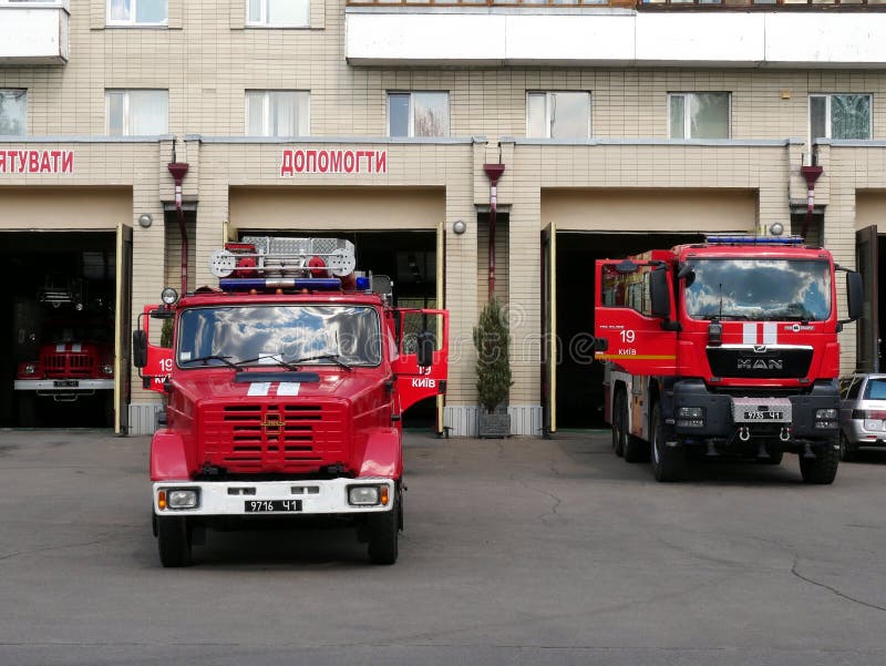 Red Fire Engines Standing at the Fire Station during the Day. Editorial ...