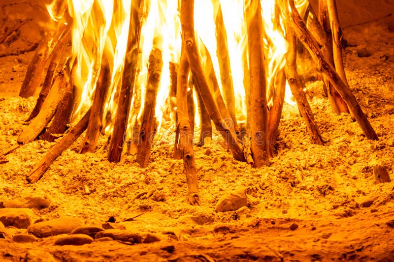 Fire with Sticks Burning in a Pit Stock Photo - Image of firely, ambers ...