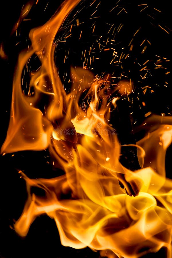Fire with Swirls of Sparks in the Night Stock Image - Image of ...