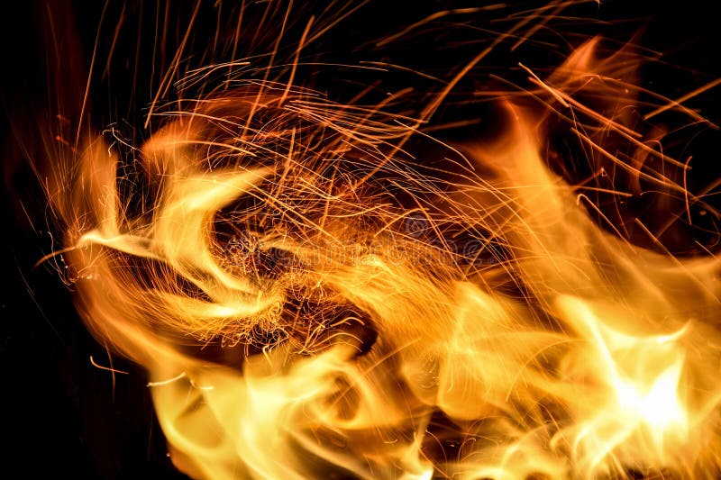 Fire with Swirls of Sparks in the Night Stock Photo - Image of blaze ...