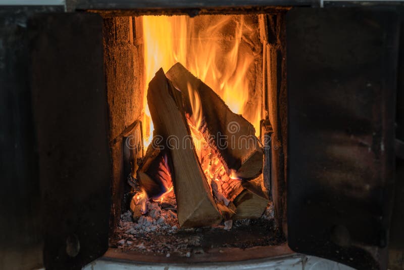 Fire in a Tiled Stove with White Tiles Stock Image - Image of winter ...