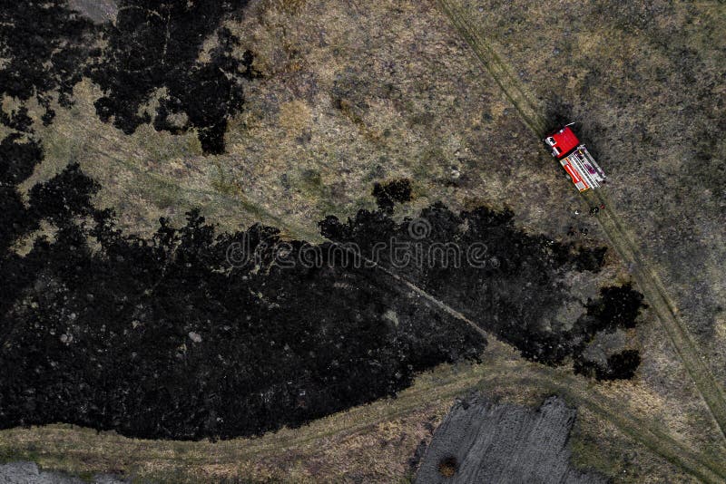Fire Truck in the Middle of the Burnt Grass Top View from the Drone ...