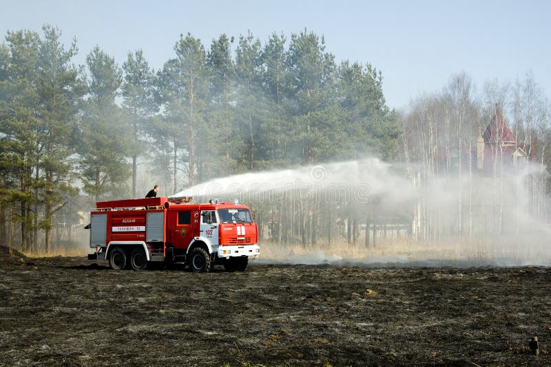 The Fire Truck Extinguishes a Fire Editorial Stock Photo - Image of ...