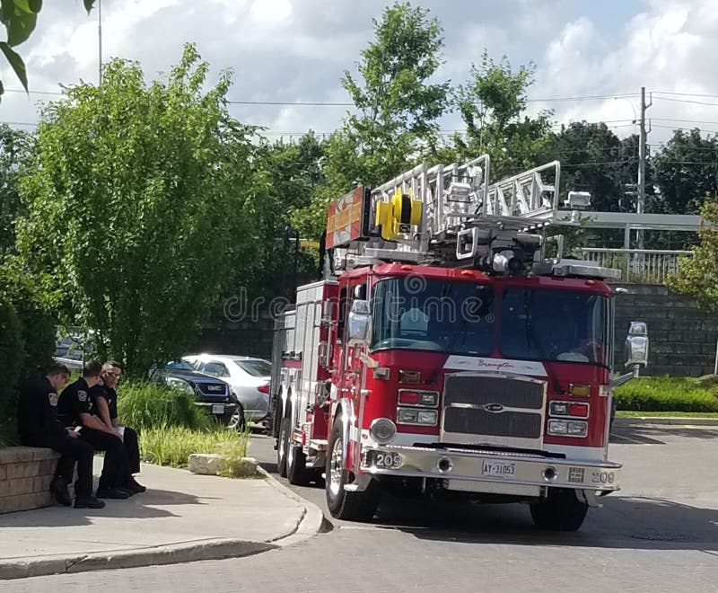 Fire truck and firemen editorial photography. Image of fire - 163431242