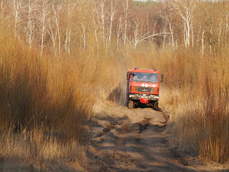 Fire Truck on a Forest Road To Extinguish a Fire in the Forest ...