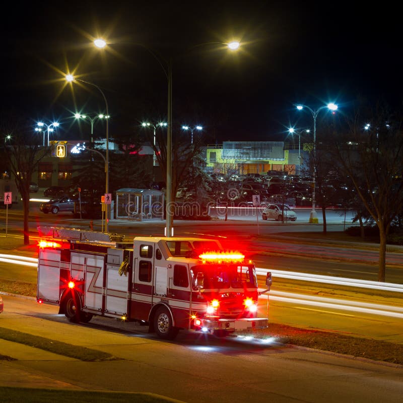 Fire Truck with Emergency Lights Driving at Night Stock Photo - Image ...