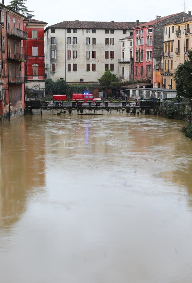 Fire Truck with Sirens on the Bridge during the River Flooding with ...