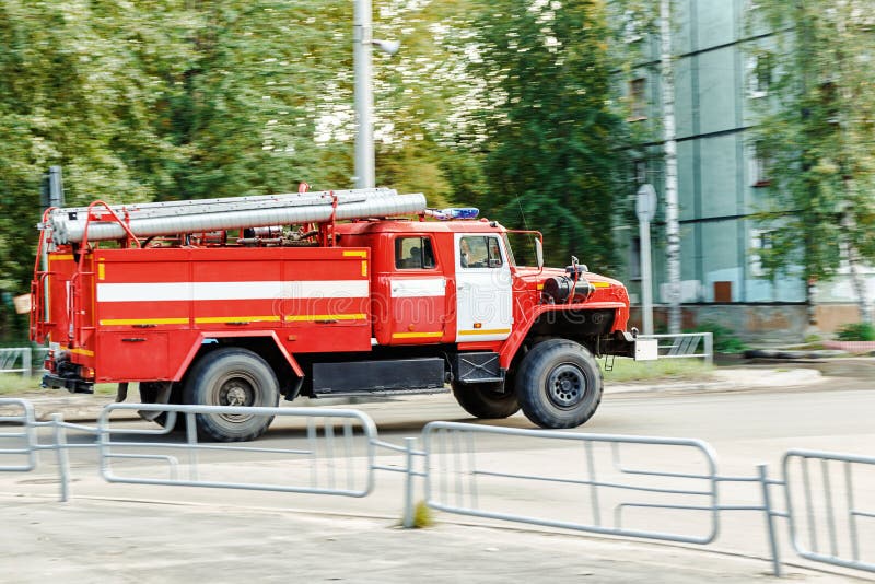 Fire truck to the rescue stock photo. Image of adult - 100356512