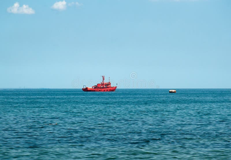 A Fire Tug Sails Along the Black Sea Stock Photo - Image of service ...