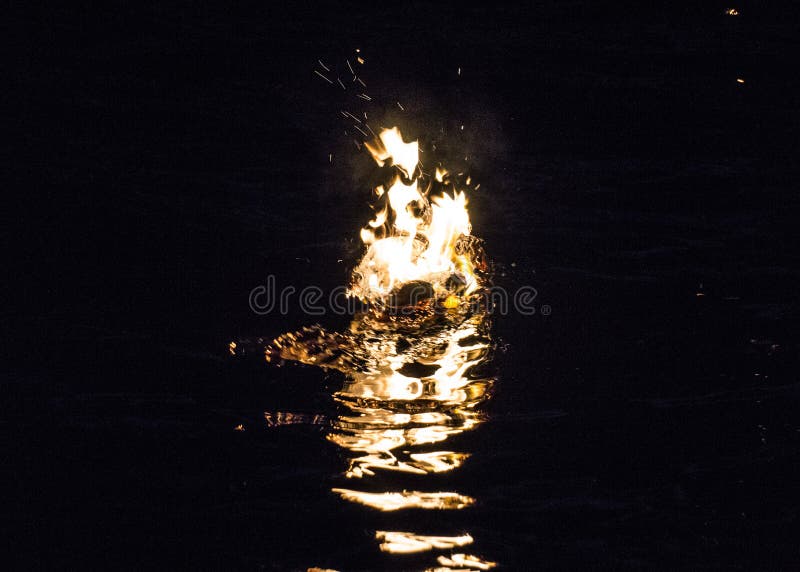 Fire on the water stock photo. Image of black, surronded - 134360590