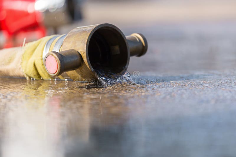 Fire Water Hose Connector on the Ground Stock Image - Image of gear ...