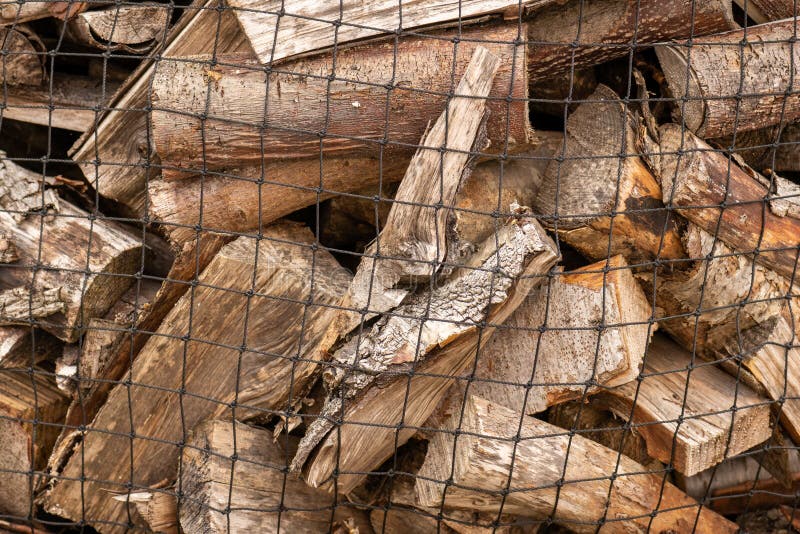 Fire wood in a large net.. stock image. Image of nature - 258740091