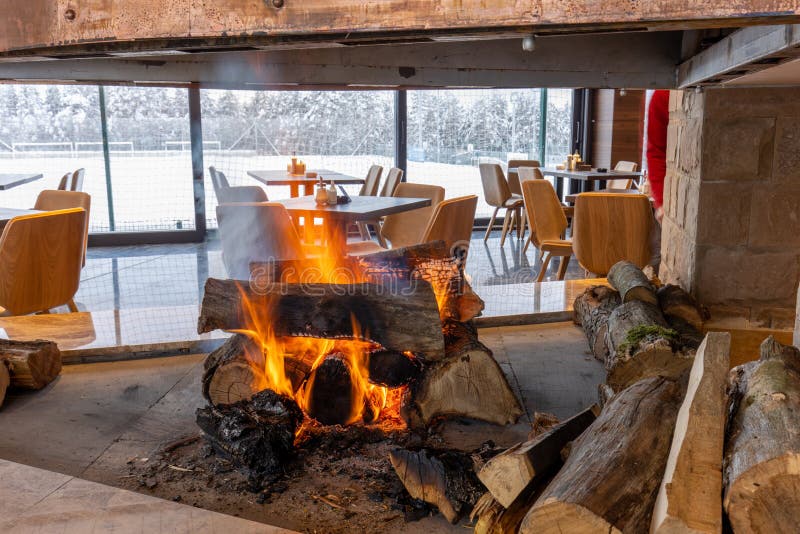Fire, Wood Logs, Burning in the Fireplace in Mountain Restaurant Stock ...