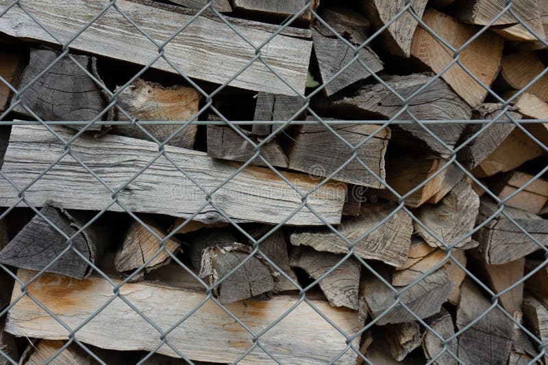 Fire Wood Stack Piled Up Behind Fence Stock Image - Image of nature ...