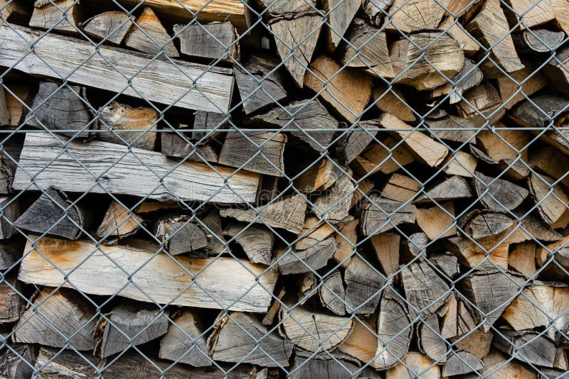 Fire Wood Stack Piled Up Behind Fence Stock Photo - Image of outdoor ...