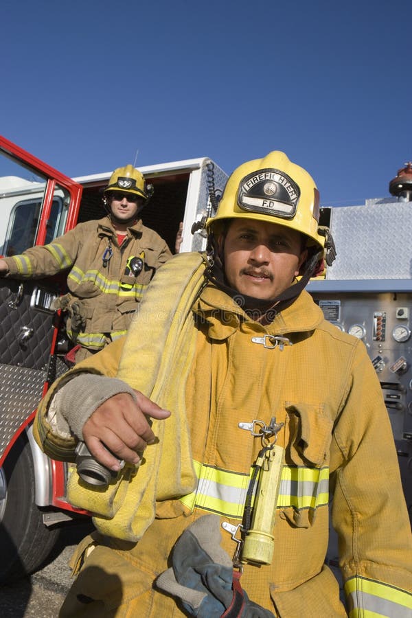 Fireman with Coworker Standing at the Fire Brigade S Door Stock Image ...