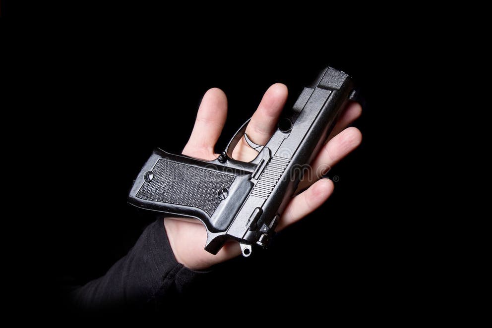 A Firearm in the Hands of a Man Defending or Attacking Stock Image ...