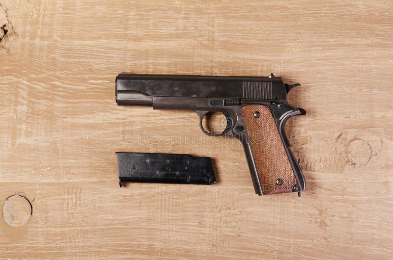 Weapon. Pistol on Wooden Background. Firearms for Protection and Stock ...