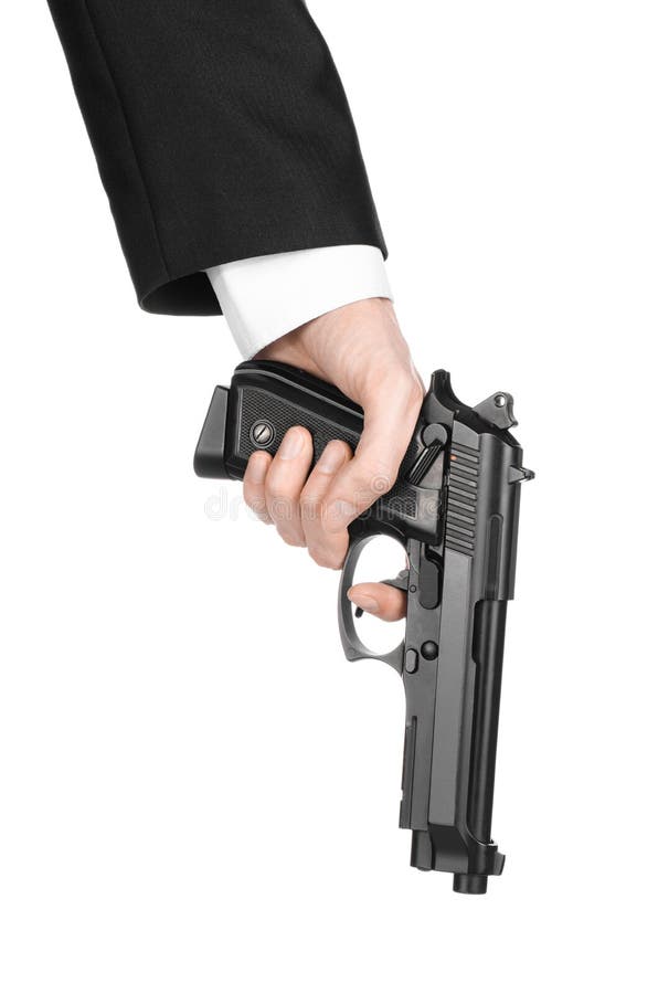 Firearms and Security Topic: a Man in a Black Suit Holding a Gun on an ...