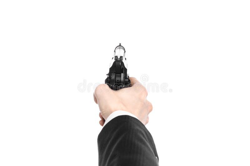 Firearms and Security Topic: a Man in a Black Suit Holding a Gun on an ...