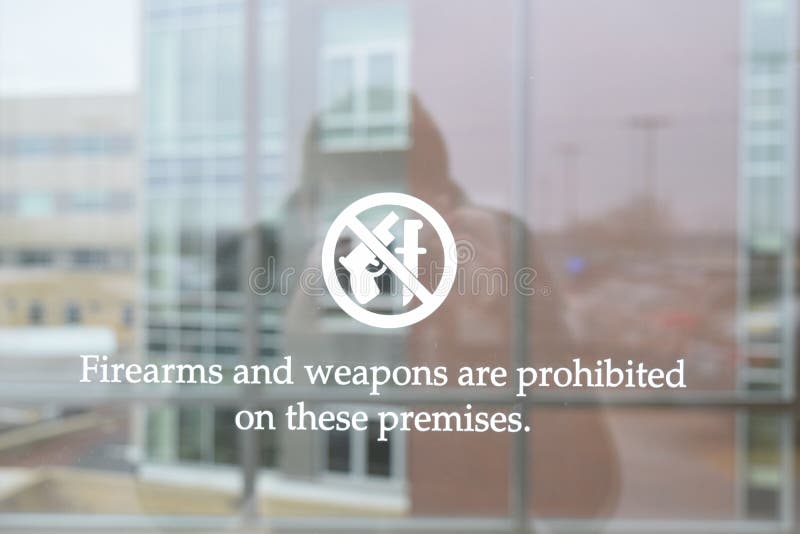 No Firearms or Weapons Sign on the Glass Entrance Door Stock Photo ...