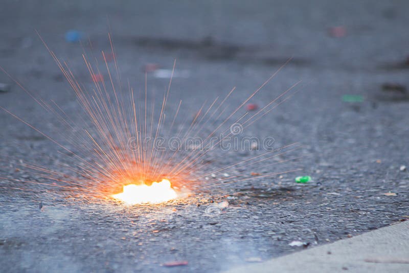 Firecracker Exploding with Light Splash on the Road during Phuket ...