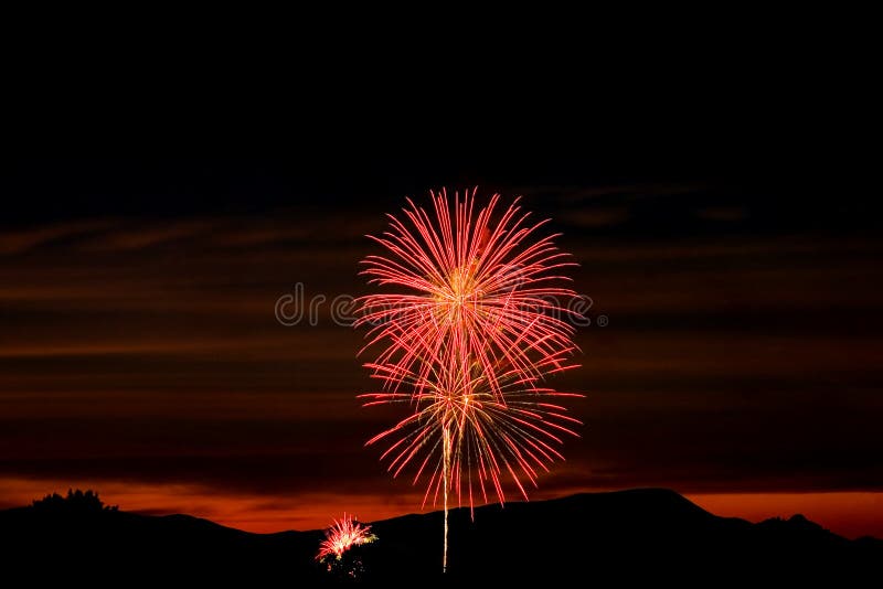 Firecrackers in the Sky during Sunset Stock Image - Image of fireballs ...