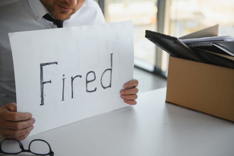Fired Employee Holding Fired Sign in Hand Stock Photo - Image of ...